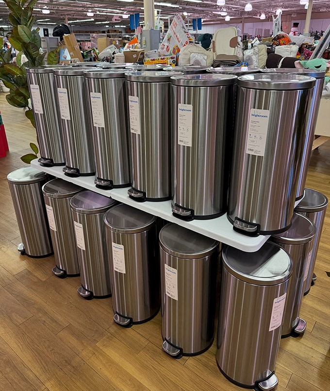 Stainless steel trash bins lined up like soldiers ready for duty. Who knew garbage disposal could look this sophisticated?