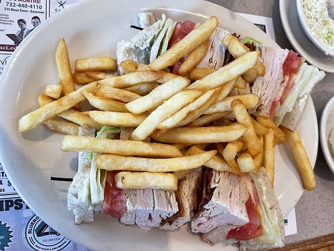 The club sandwich&mdash;architecture you can eat. Layers of turkey, bacon, and veggies stacked higher than your weekend to-do list.