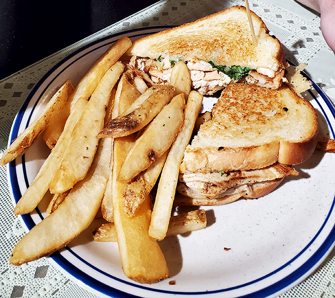 This isn't just a sandwich&mdash;it's architecture with mayo, a towering achievement of bread, meat, and melty cheese worth every napkin.