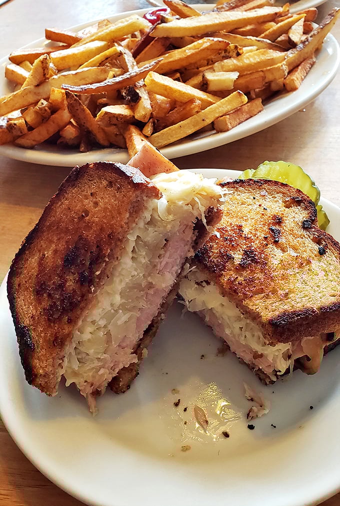 The Reuben's sophisticated cousin &ndash; turkey, sauerkraut, and Swiss on perfectly grilled rye with a side of golden fries.