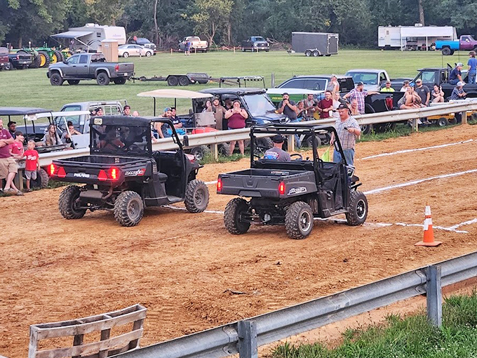 Rural NASCAR has arrived! The crowd leans forward in unison as these UTVs tear around the track with surprising speed.