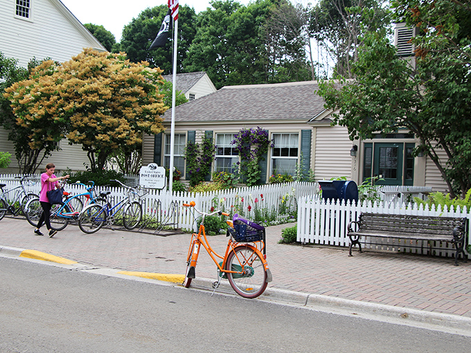White picket fences and colorful gardens frame this charming cottage, where bicycles replace cars as the preferred method of island transportation.
