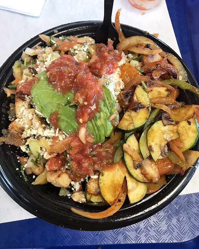 This veggie-forward bowl proves that meatless doesn't mean joyless, with grilled zucchini and fresh avocado creating a fiesta of textures.