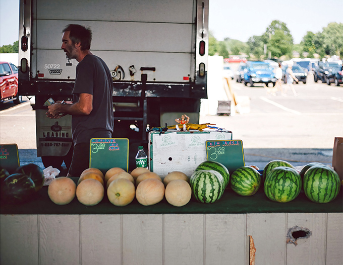Nothing says "authentic market experience" quite like vendors selling produce straight from their trucks with genuine pride.