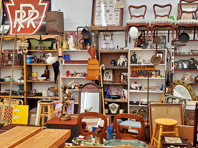 A collector's corner where advertising meets Americana&mdash;that Pennsylvania Railroad sign would look perfect in any train enthusiast's den.