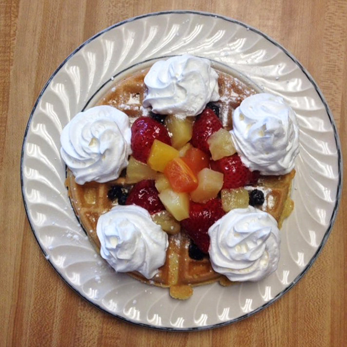 A waffle that's dressed for success with fresh fruit and whipped cream. Breakfast or dessert? The line blissfully blurs.
