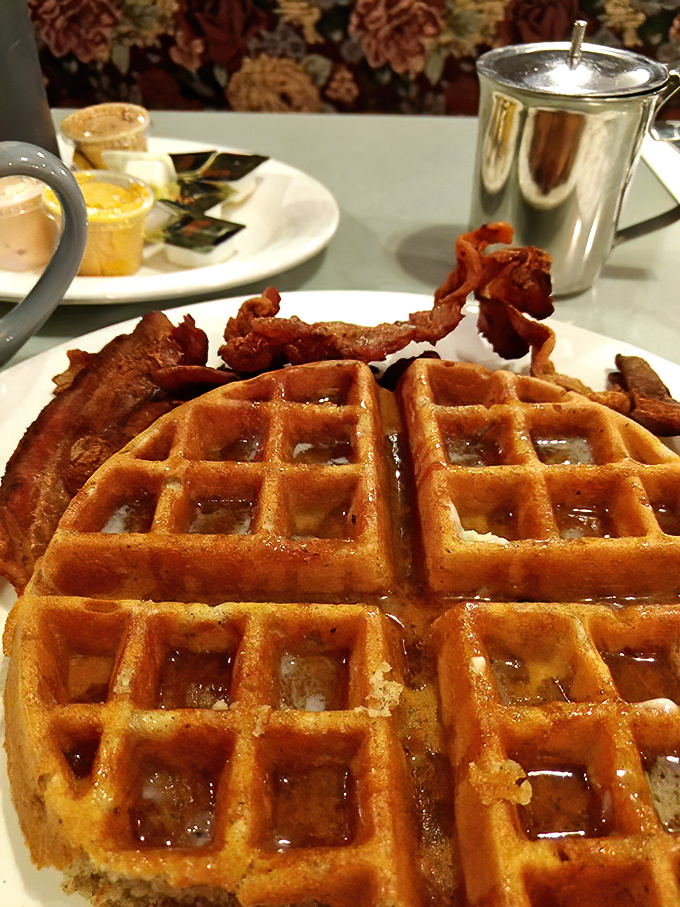 Golden waffles with crispy bacon—the breakfast equivalent of Fred Astaire and Ginger Rogers, dancing together in perfect harmony on your plate.