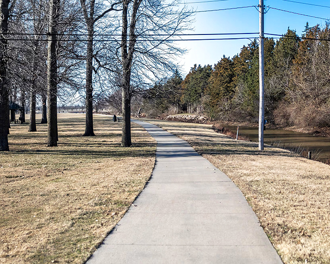 Walking paths meander alongside tranquil waters, offering the kind of peaceful morning stroll that big-city dwellers pay premium gym memberships to simulate.