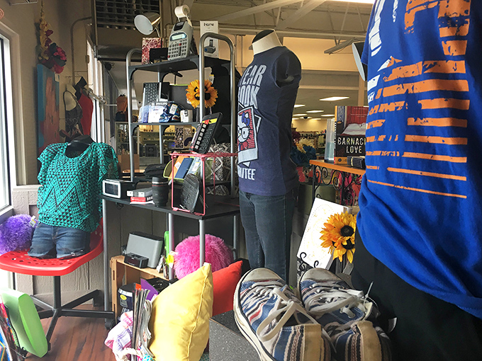 Window shopping takes on new meaning with this colorful display. Like a fashion fever dream, mannequins showcase the eclectic personality that thrifting celebrates.
