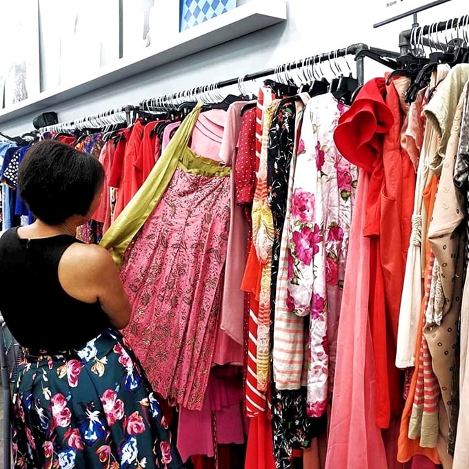 A rainbow of possibilities hangs in wait. These vibrant dresses could be someone's perfect wedding guest outfit or next vintage fashion statement.