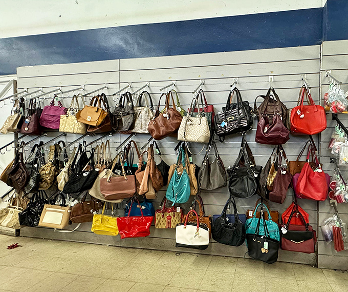 Handbag heaven! Designer purses hang like colorful fruit on a very fashionable tree. Some still have original tags&mdash;the thrift store equivalent of winning the lottery.
