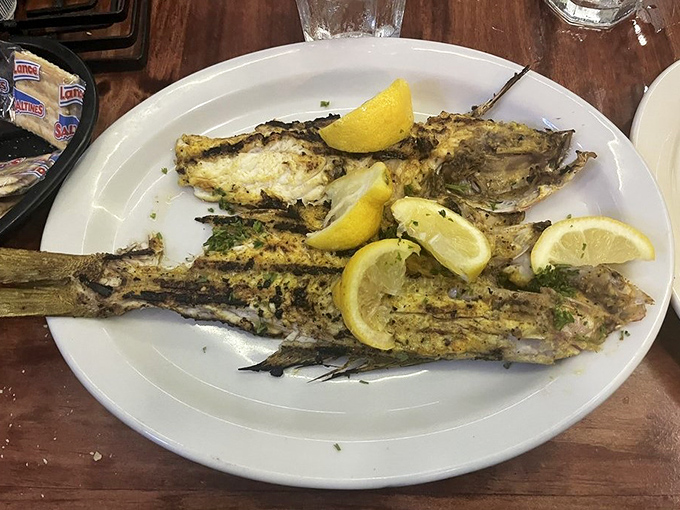 The whole yellowtail snapper arrives like seafood royalty &ndash; head-on, perfectly charred, and ready to make you forget every fish sandwich you've ever had.