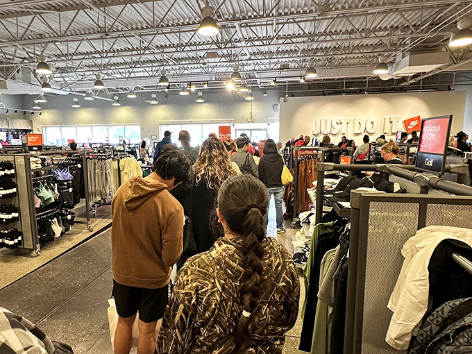 The Nike checkout line: where strangers bond over their athletic aspirations and shared victory of scoring premium swooshes at discount prices.