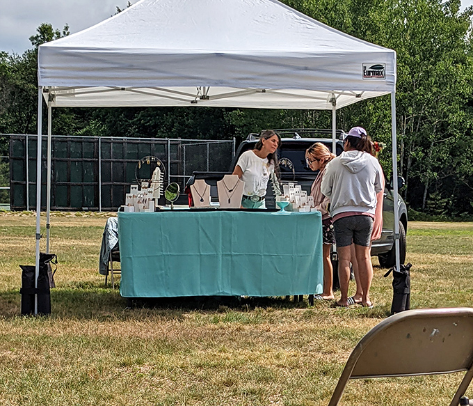 Artisanal jewelry displayed under summer skies. The real accessory here? The genuine connection between maker and future wearer.