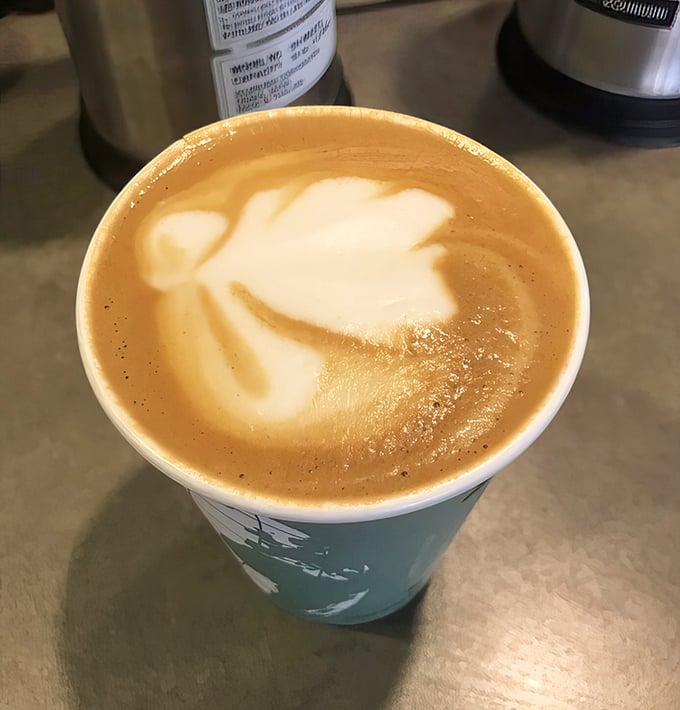 Latte art that's almost too pretty to drink. Almost. The leaf design whispers, "Instagram me before you destroy me."