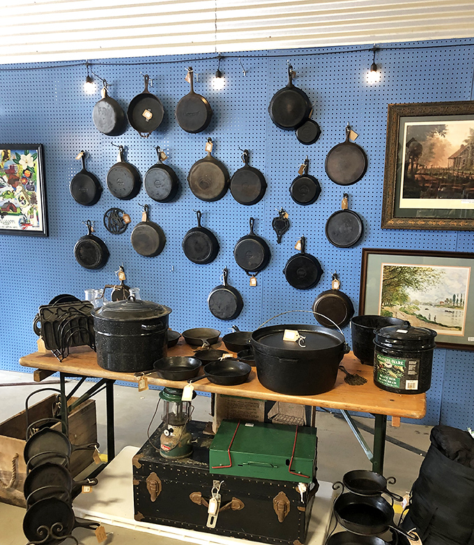Cast iron cookware display that would make your grandmother nod in approval. These pans have seasoned more Sunday dinners than most chefs have in their careers.