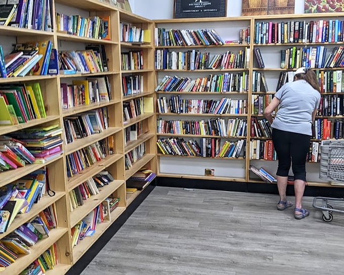 A bibliophile's dream corner where literary treasures hide between worn covers. That shopper is experiencing the thrill of the hunt in its purest form.