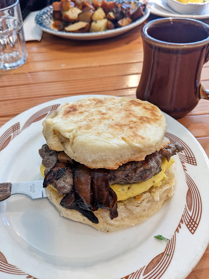 The breakfast sandwich that makes you question every drive-thru decision you've ever made. That biscuit looks like it could float away if not anchored by bacon.