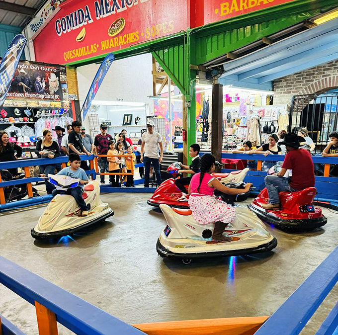 Bumper cars bring childhood joy to market-goers of all ages. These mini-motorists navigate their colorful vessels with the same determination they'll use haggling for deals later. 