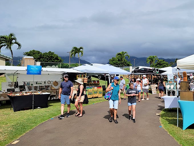 The real Hawaii reveals itself between these tents, where authentic island commerce happens without a resort fee in sight.