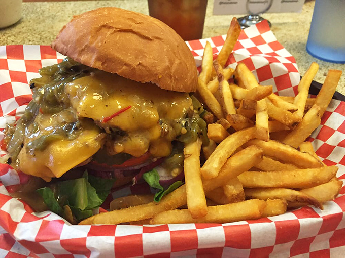 The green chile cheeseburger doesn't just satisfy hunger&mdash;it creates memories. Melted cheese cascades over roasted chiles while golden fries stand at attention, ready for their moment.