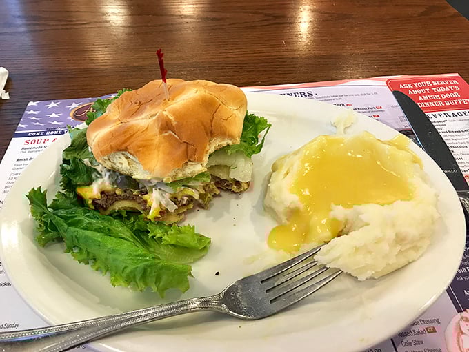A classic cheeseburger and a scoop of creamy mashed potatoes—it’s a plate of satisfying Americana, done the proper Amish way.