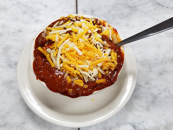 This bowl of chili topped with melted cheese isn't just comfort food&mdash;it's a warm hug for your taste buds on a chilly Montana day.