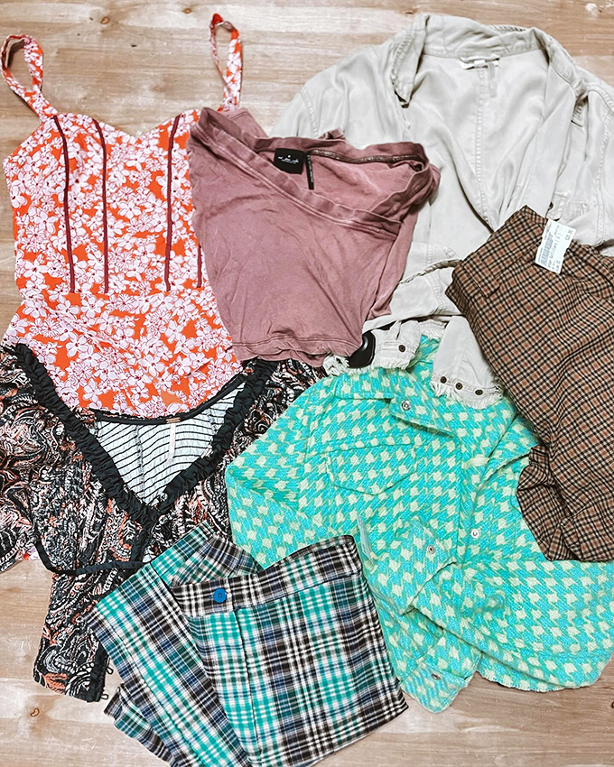 A rainbow of options awaits on the sales floor, where clothing racks create a labyrinth of potential wardrobe upgrades.