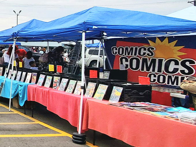 Comic book heaven under a blue tarp! Where else can you find Batman, Spider-Man, and childhood nostalgia all in one sun-drenched spot?