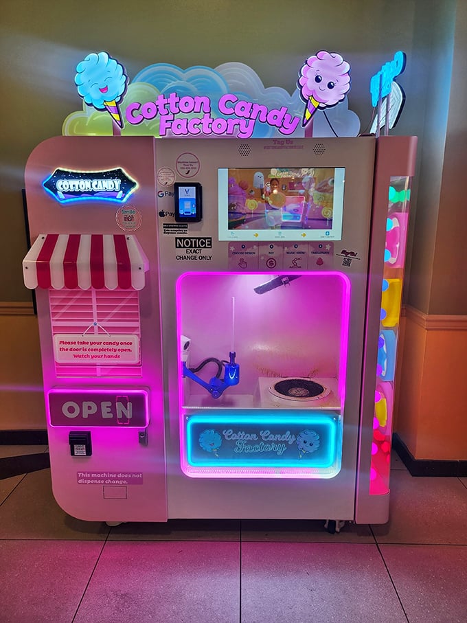 The Cotton Candy Factory machine stands like a pink neon beacon of childhood joy. Shopping calories don't count when they're consumed between bargain hunts.