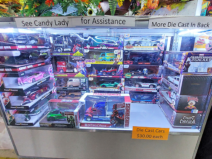 The "Candy Lady" presides over miniature automotive dreams, where pop culture and Detroit's finest meet in palm-sized perfection.