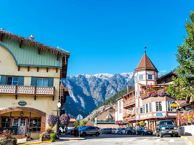 The perfect postcard view: Bavarian-style buildings nestled against mountain backdrops, creating a scene so picturesque it makes your smartphone camera feel inadequate.