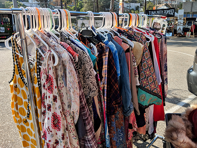 Vintage dresses in a rainbow of patterns. Each hanger holds someone's future "where did you get that?" conversation starter.
