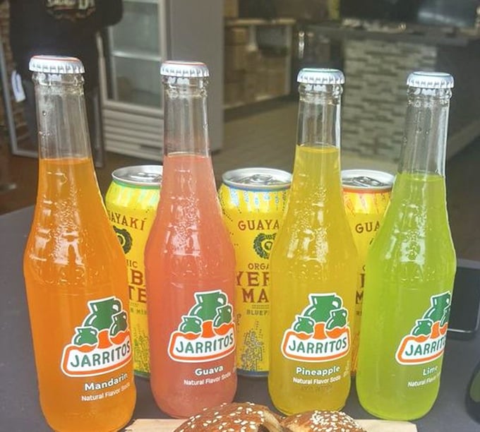 Colorful Jarritos sodas standing at attention like sugary soldiers. Their fruity sweetness is the perfect counterpoint to all that savory smoke.