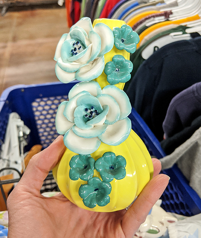A sunny yellow vase with turquoise flowers that screams "I was fabulous in someone's 1980s living room and I'm ready for my comeback tour!"