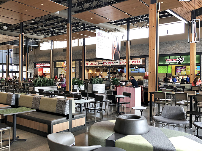The food court: where shopping warriors refuel before diving back into the retail battlefield with renewed vigor and empty hands.