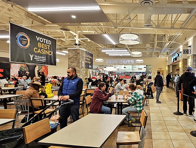 The food court: where shopping warriors refuel between retail battles. Even bargain hunters need sustenance for the next round.