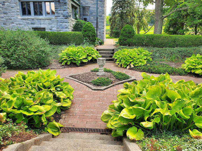 Garden paths that make your backyard look like amateur hour. Hostas and hedges frame brick walkways with military precision.