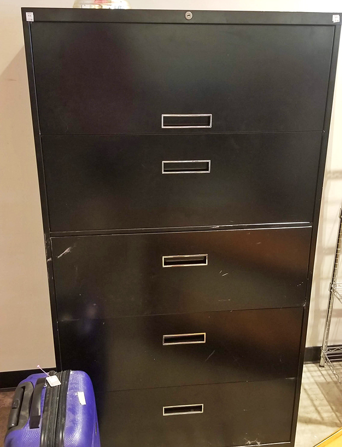 Office furniture that means business. This filing cabinet has probably held more secrets than most government agencies.