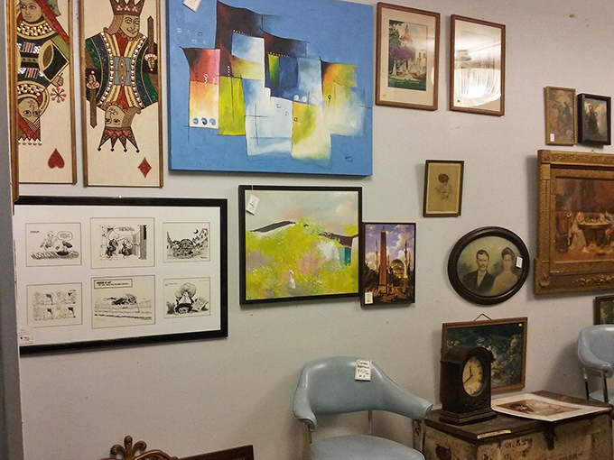 Wall art that ranges from playing card kings to abstract splashes&mdash;someone's former living room decor awaits its second act.