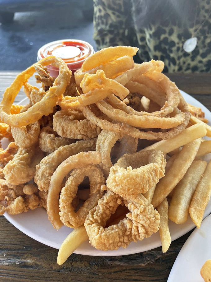 A mountain of fried calamari rings that puts chain restaurants to shame. This isn't just appetizer territory&mdash;it's a commitment to seafood excellence worth every crispy, tender bite.