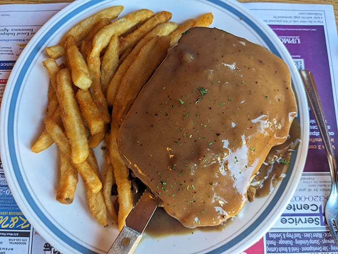 Hot turkey smothered in rich, savory gravy alongside perfectly cooked fries&mdash;a comforting classic that keeps locals coming back.