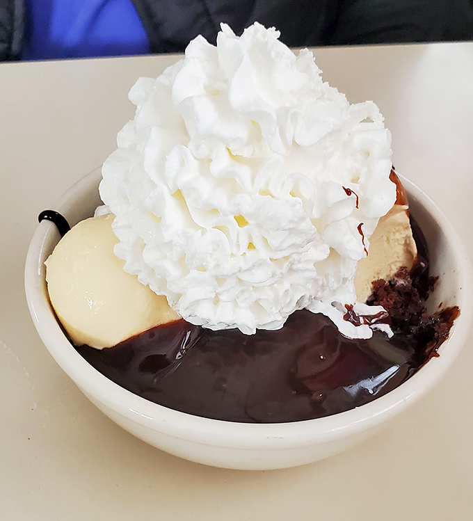 Ending the meal with this decadent dessert! Layered with rich flavors and topped with a huge cloud of whipped cream. Yum!