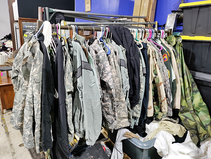 Military surplus meets practical workwear&mdash;these racks hold camouflage treasures for outdoor enthusiasts and practical everyday wear.
