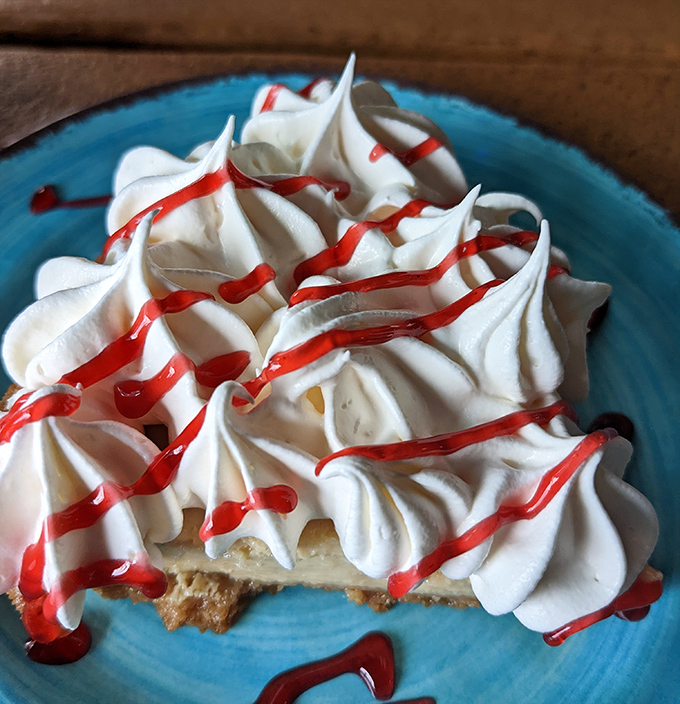 Their key lime pie wears a cloud of whipped cream with raspberry drizzle &ndash; the perfect sweet-tart finale that captures Florida sunshine in every bite.