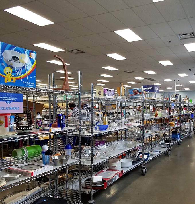 Kitchen dreams materialize in these metal shelves, where forgotten serving bowls and once-loved platters await their culinary comeback.