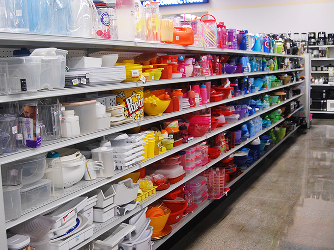 Kitchen gadgets organized by color create an oddly satisfying spectrum of culinary possibilities. Marie Kondo would approve of this orderly approach to secondhand housewares.