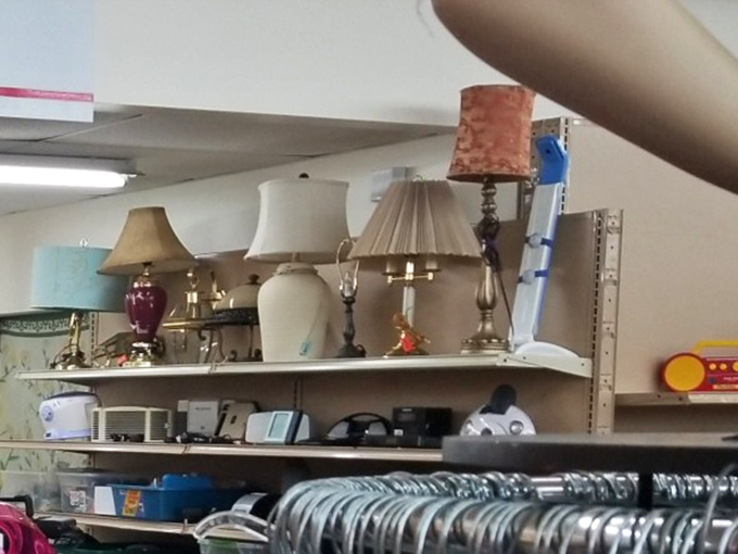 The lamp section glows with potential. That burgundy base might have illuminated someone's novel-reading in 1992, but it's ready for your bedside table now.