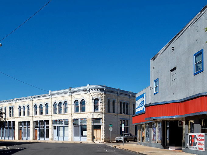 These limestone buildings along Main Street have weathered a century of Texas heat, economic ups and downs, and countless parades.