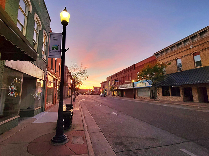 Sunset paints downtown in hues that Instagram filters desperately try to replicate but can never quite capture. 